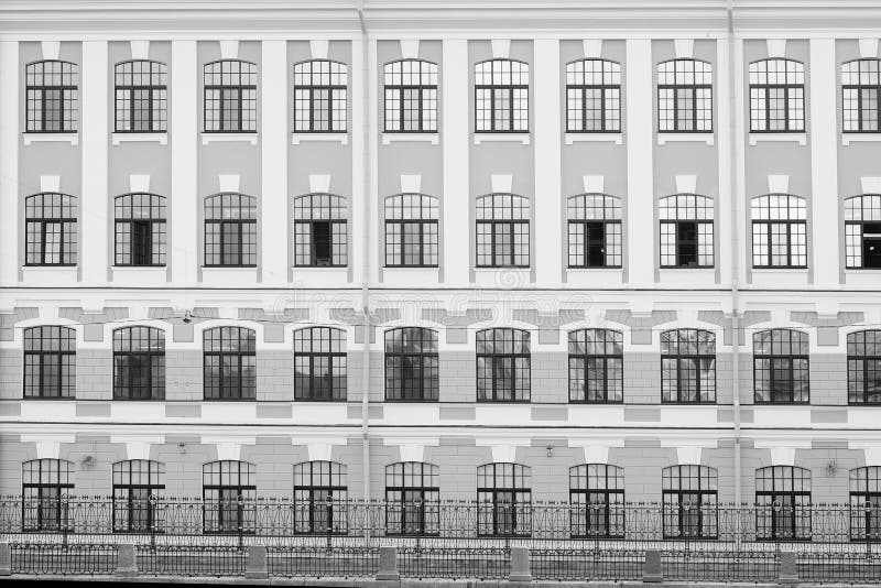 The Facade of the Building with Identical Windows in Black and White ...
