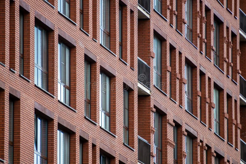 The Facade of the Building is Made of Red Brick. View from the Side ...