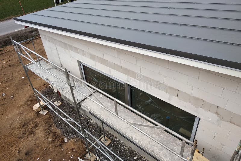 Facade of Building Made from White Blocks with Big Windows Under ...