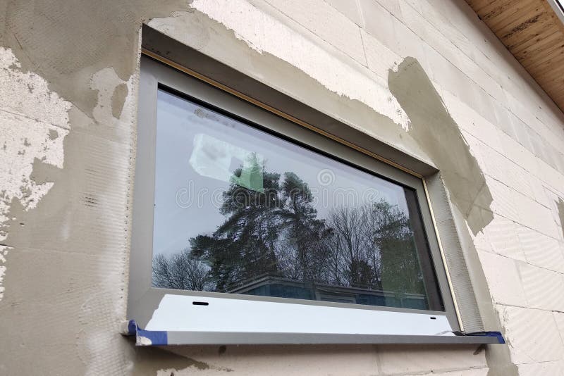 Facade of Building Made from White Blocks with Big Windows Under ...