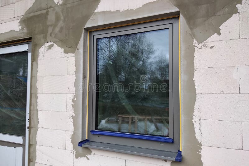 Facade of Building Made from White Blocks with Big Windows Under ...