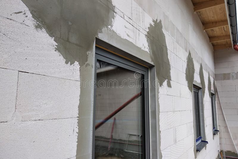 Facade of Building Made from White Blocks with Big Windows Under ...