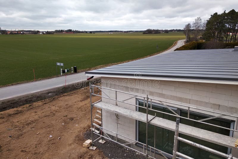 Facade of Building Made from White Blocks with Big Windows Under ...