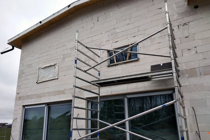 Facade of Building Made from White Blocks with Big Windows Under ...