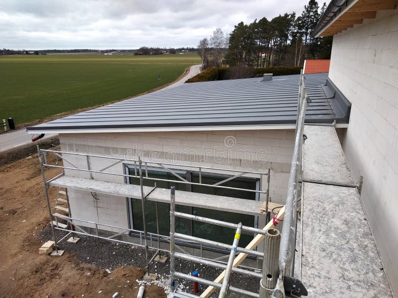 Facade of Building Made from White Blocks with Big Windows Under ...