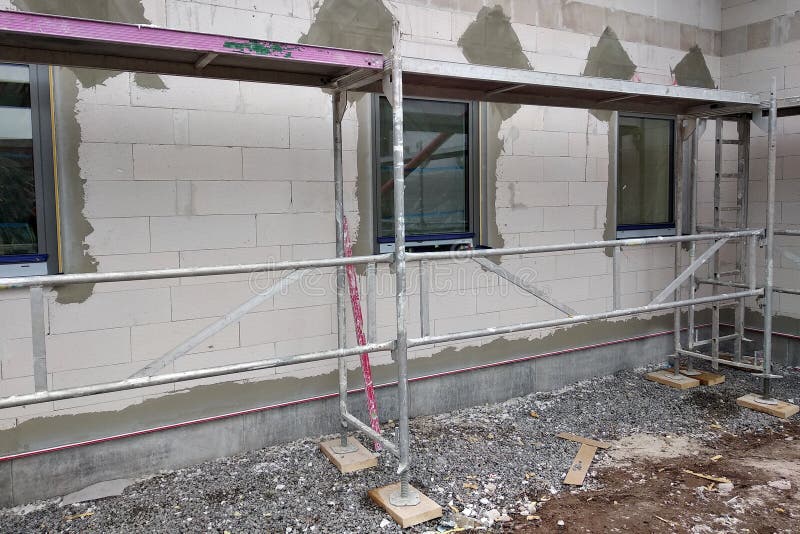 Facade of Building Made from White Blocks with Big Windows Under ...
