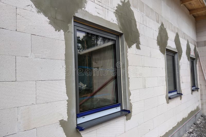 Facade of Building Made from White Blocks with Big Windows Under ...
