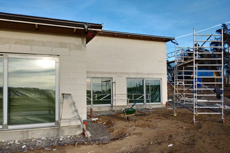 Facade of Building Made from White Blocks with Big Windows Under ...