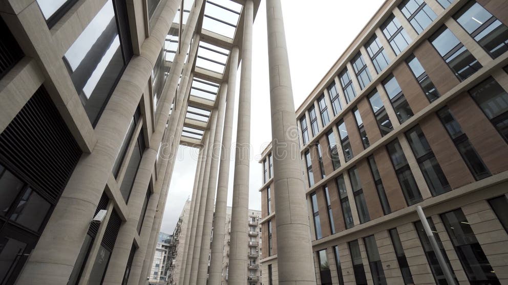Facade of a Building with Marble Columns. Action. Bottom View of a ...