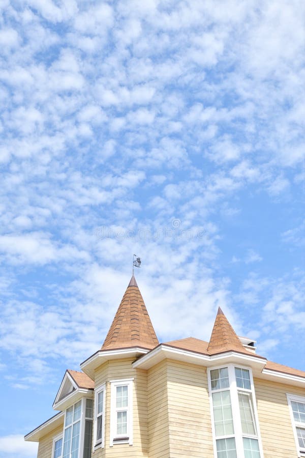 The Facade of the Building with Weathervane Stock Photo - Image of ...