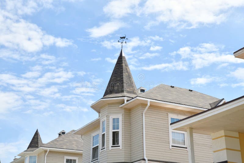 The Facade of the Building with Weathervane Stock Image - Image of ...