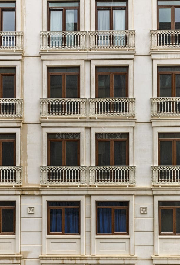 Facade of a Building with Windows and Balconies Stock Photo - Image of ...