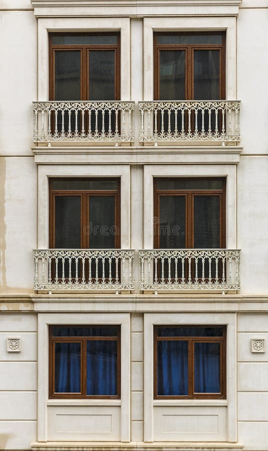 Facade of a Building with Windows and Balconies Stock Photo - Image of ...