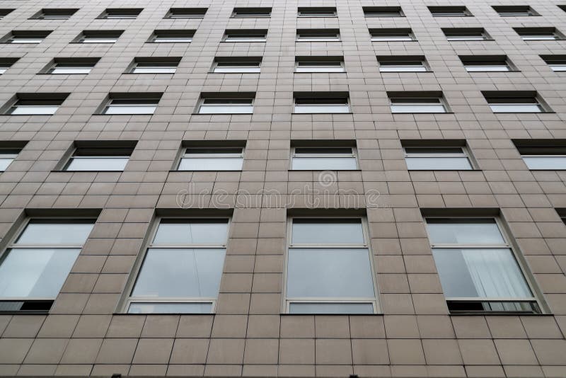 Facade of a Building with Windows. Texture for the Background. Stock ...