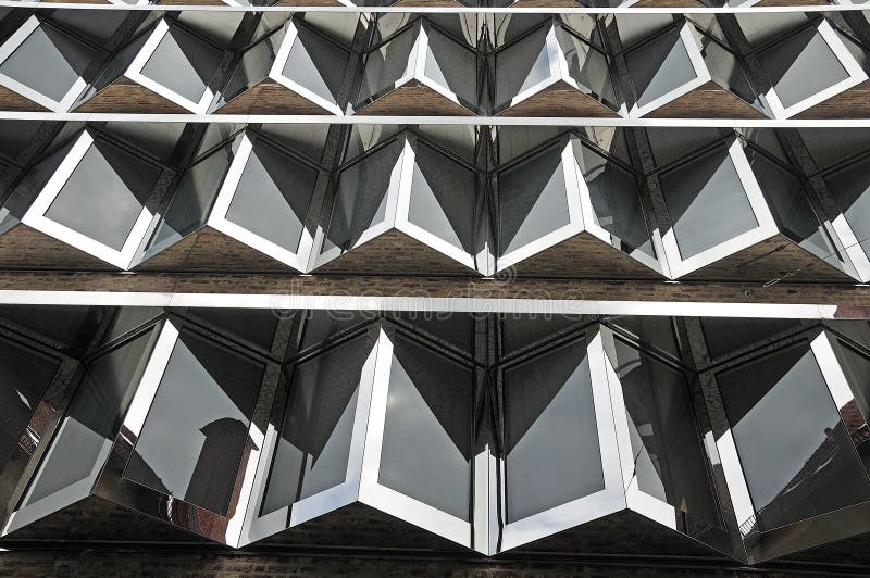 Overhanging Windows in Triangular Shape Stock Image - Image of glass ...