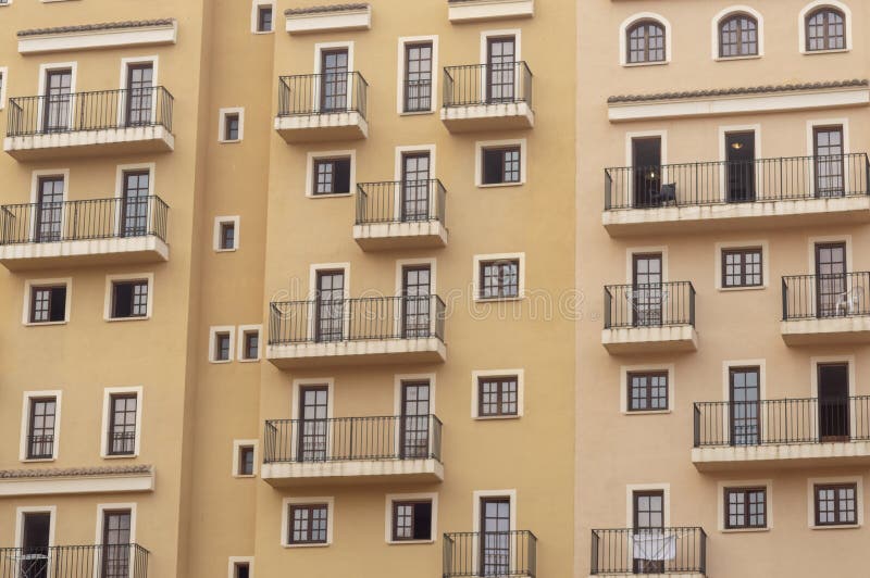 Facade of a Community with Multiple Balconies and Windows of Different ...