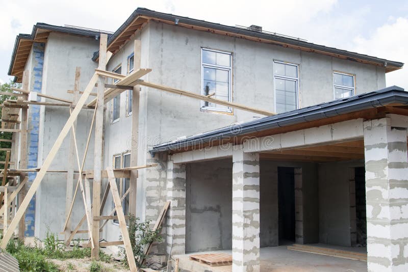 Facade of Cottage Under Construction Covered with Plaster with New ...