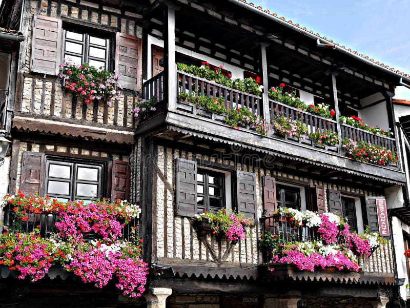 Facade full of flowers stock image. Image of stone, building - 134104581