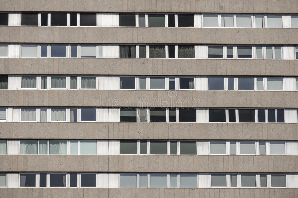Facade with Granite Cladding and a Multitude of Similar Windows Stock ...