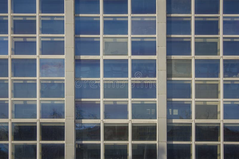 Facade of High Glass Modern Building with Square Windows and a ...