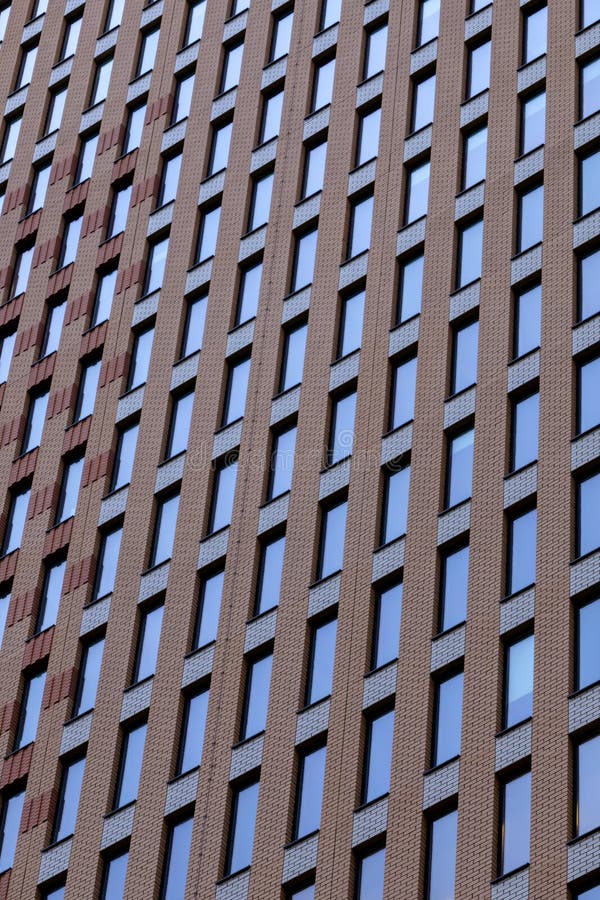 Facade of a High-rise Brick Building with Windows Stock Image - Image ...