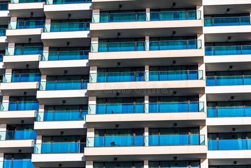 Facade of high-rise hotels stock image. Image of apartments - 130614361
