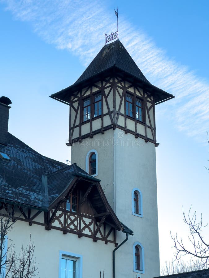 Facade of a Historical Building with a Tower in the Evening Twilight ...