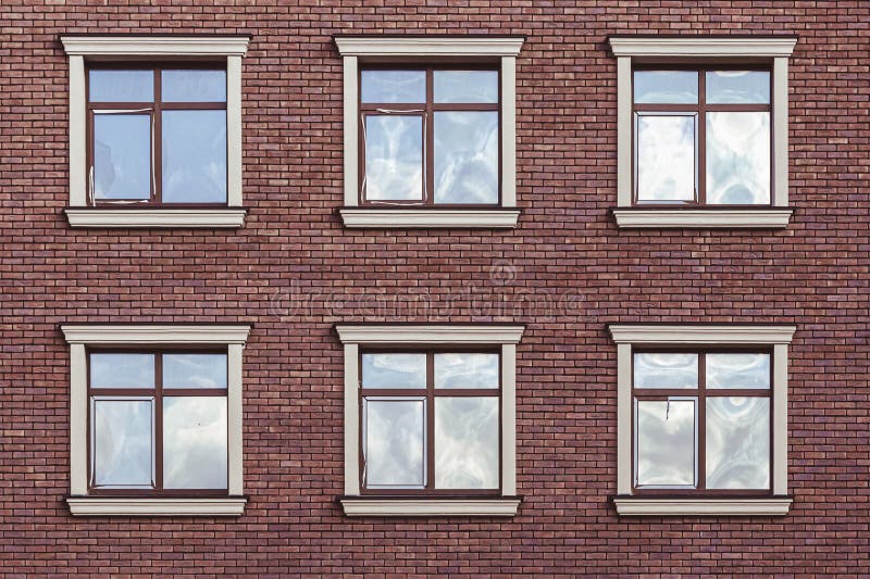 The Facade of a Brick House with Identical Square Windows Stock Photo ...