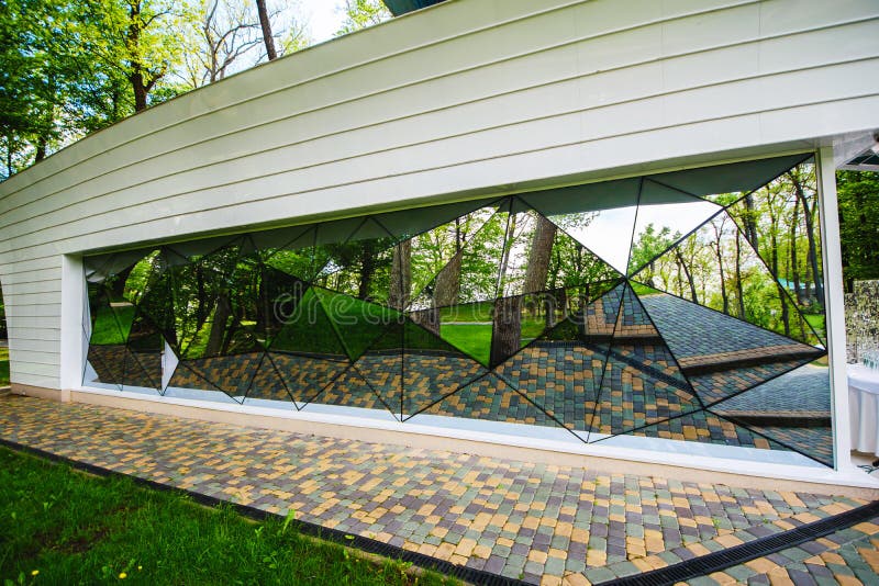 Facade of the House with Mirrored Windows in the Park. Stock Photo ...