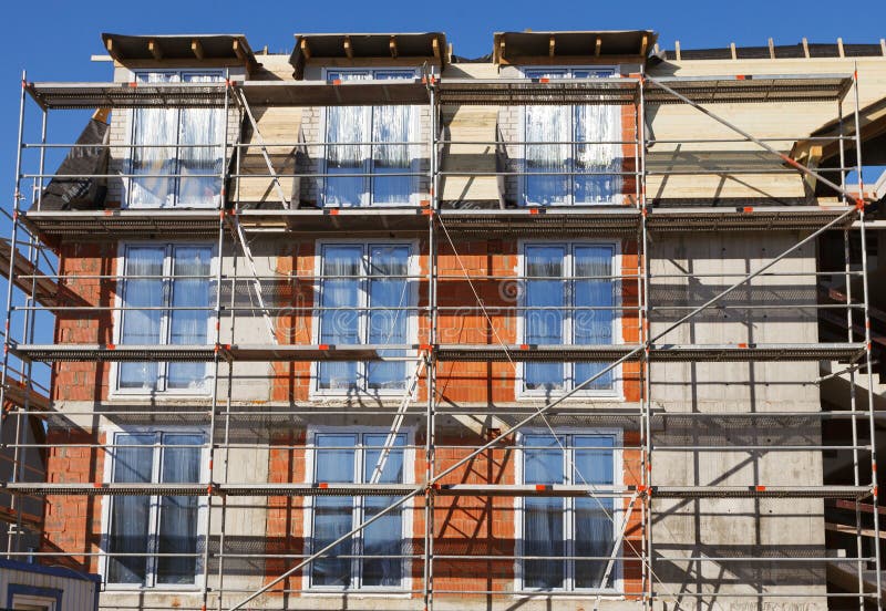 The Facade of a House Under Construction with Scaffolding Stock Image ...