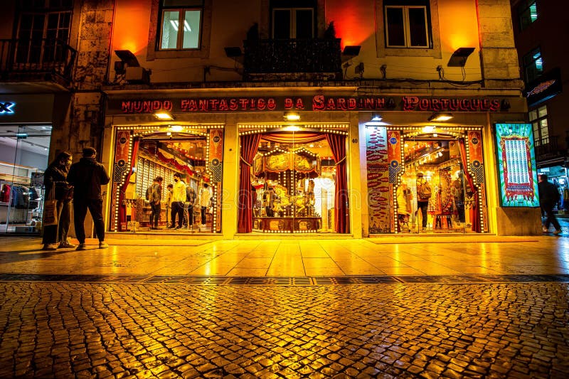 Facade of the Illuminated Store in Lisbon at Night, Portugal Editorial ...