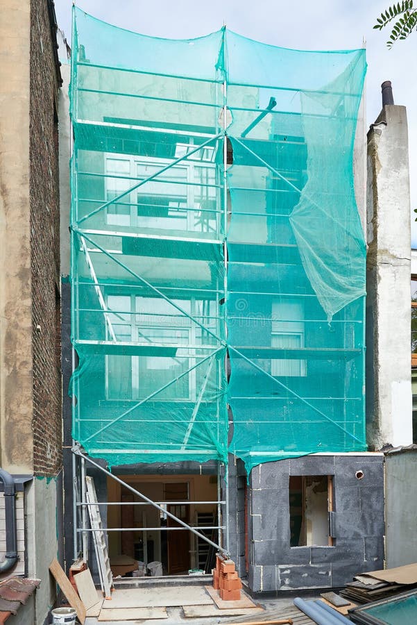 Facade Insulation with Protected Scaffolding Stock Image - Image of ...