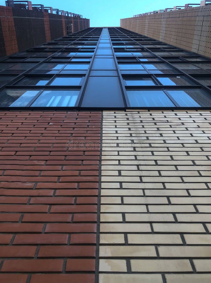 The Facade of a Large Apartment Building with Black Windows Stock Image ...