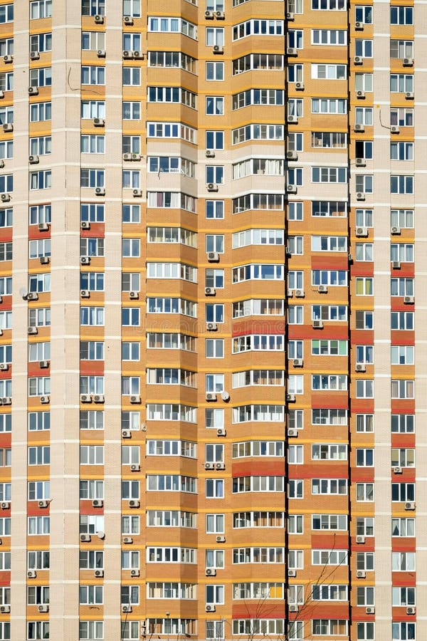 Facade Of A Large Multi-storey Block Of Flats With Many Windows Over ...