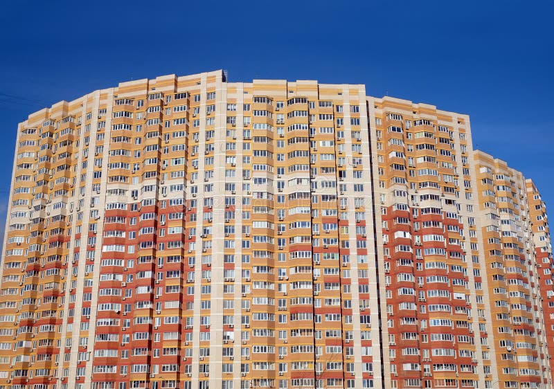 Facade of a Large Multi-storey Block of Flats with Many Windows Over ...