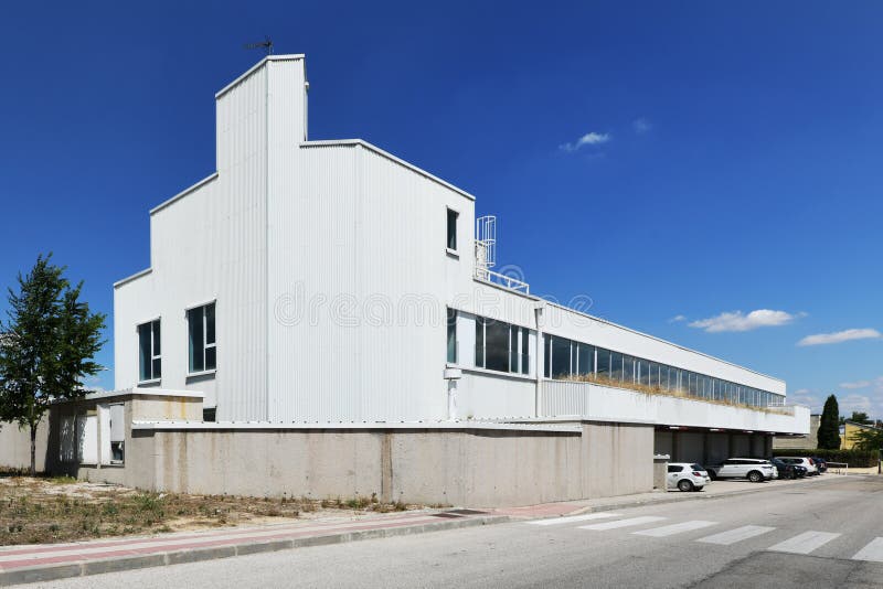 Facade of a Lonely Industrial Building with White Cladding, Many ...