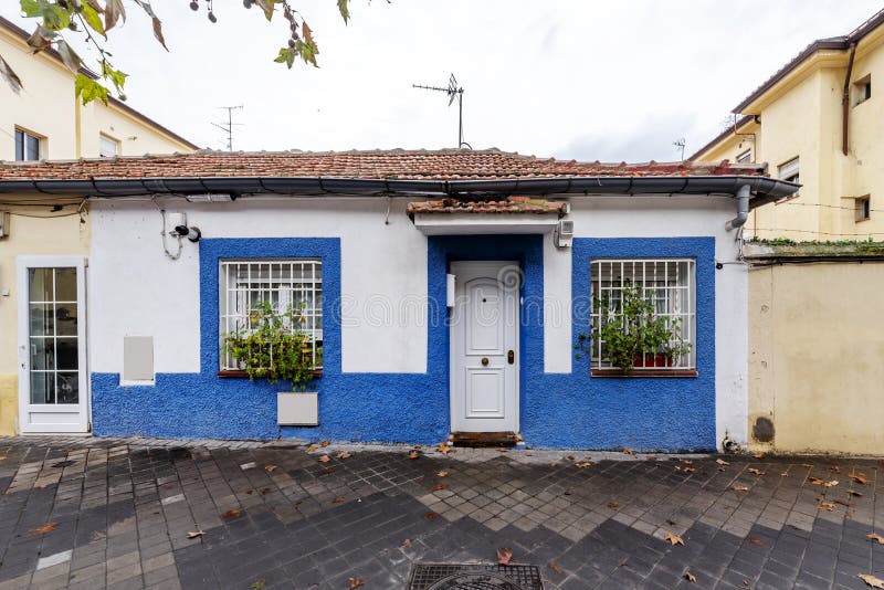 Facade of a Low Residential House Painted Blue and Balcony Stock Photo ...
