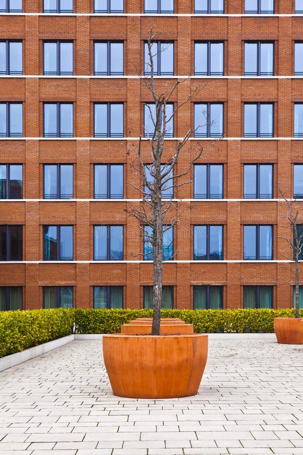 Facade of Modern Brick Building with a Tree in Front Editorial Photo ...