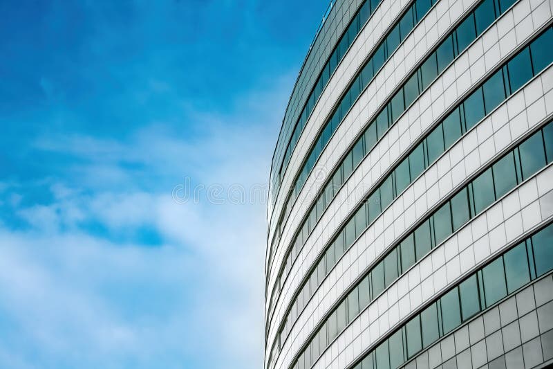 The Facade of a Modern Building at an Angle Against a Blue Sky ...