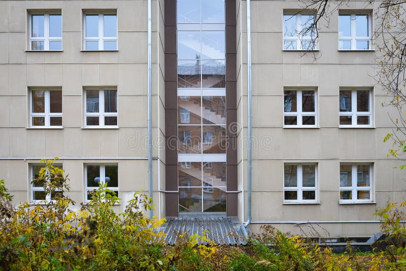Facade of a Modern Building of Gray Sandwich Panels with Windows and ...
