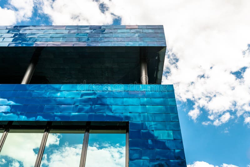 The Facade of a Modern Building Made of Glass, Blue Panels in Which the ...