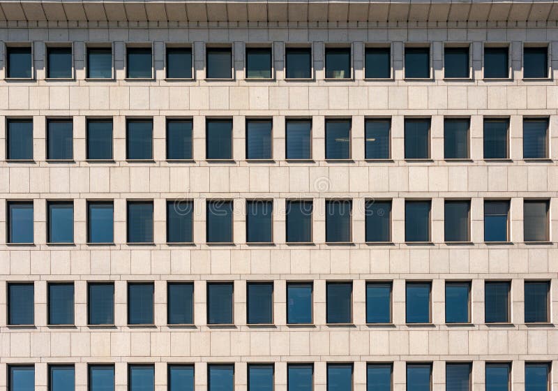 The Facade of the Modern Building with Rectangular Windows and Cornice ...
