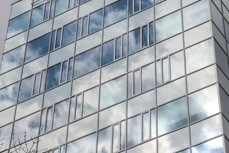 Facade of a Modern Building with the Reflection of Clouds on the Glass ...
