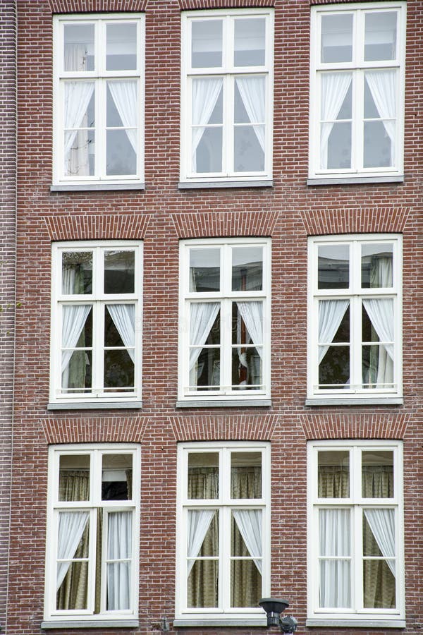 Nine Windows on a Light Blue Wall Stock Image - Image of windows, nine ...