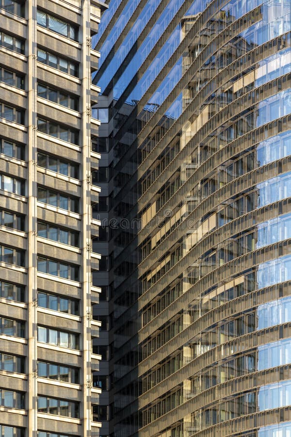The Facade of a Modern Multi-storey Building with Reflections in the ...