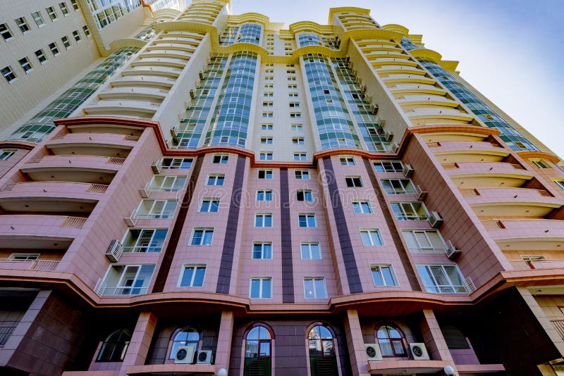 The Facade of a Modern Multi-storey High-rise Building with Windows in ...