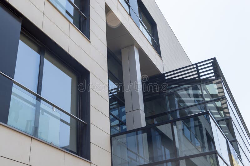 Facade of a Modern Office Building with Large Glass Windows Stock Photo ...