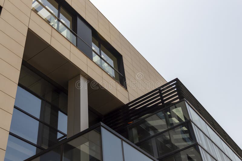 A Facade of a Modern Office Building with Large Glass Windows Stock ...