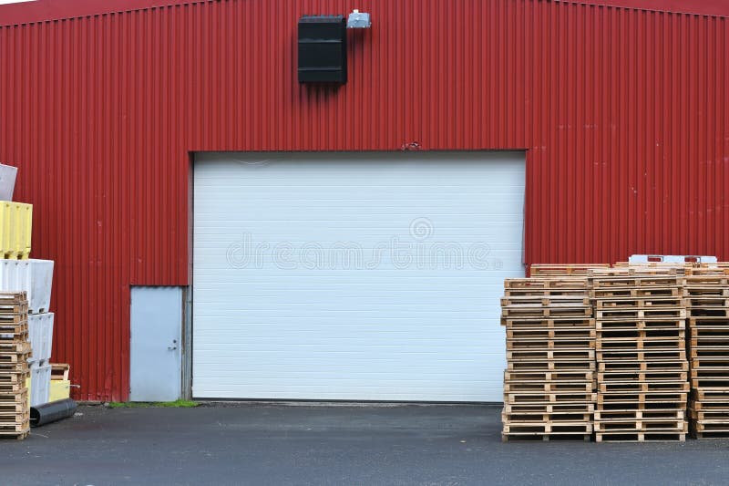 Facade of a Modern Red Warehouse Stock Photo - Image of loading, garage ...