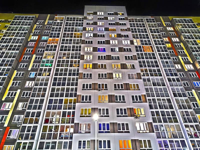 The Facade of a Multi-storey Building with Multi-colored Windows at ...